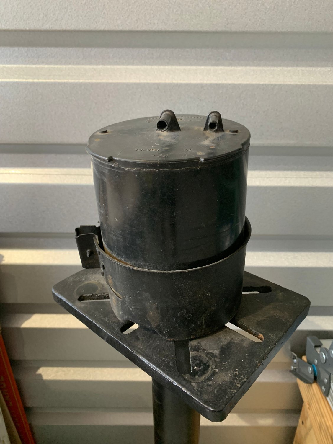 Charcoal canister and mounting bracket - ClassicOldsmobile.com