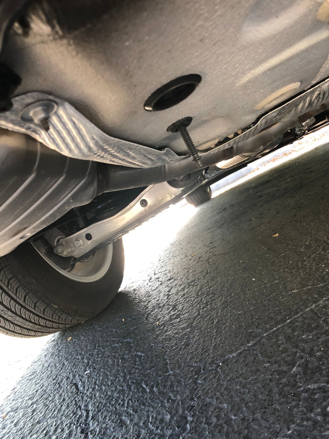 Screw/spring hanging down from rear undercarriage - AudiWorld Forums