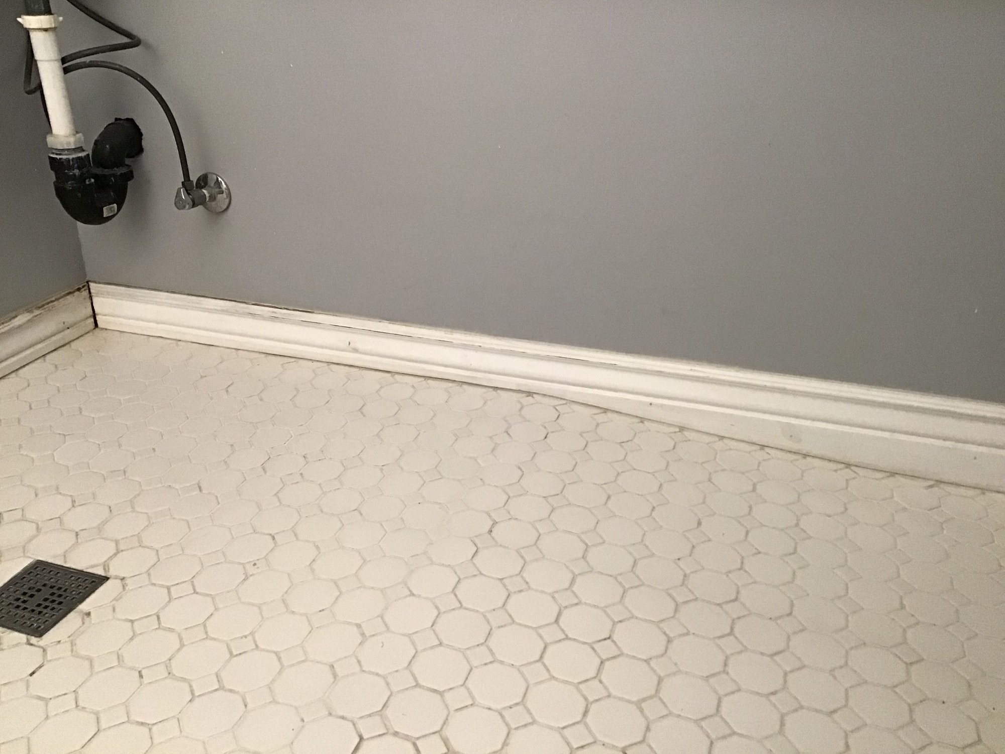 Putting a tile baseboard to a very uneven floor - DoItYourself.com ...
