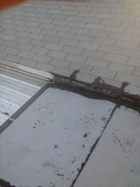 Tieing a cold application tar roof into an existing shingle roof ...